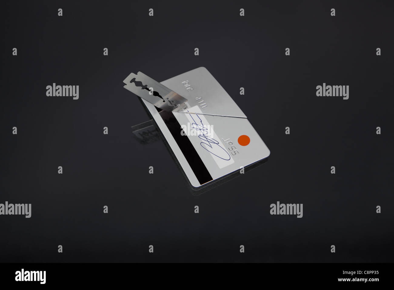 Slicing my credit card with a razor blade. Low key and copy-space Stock ...