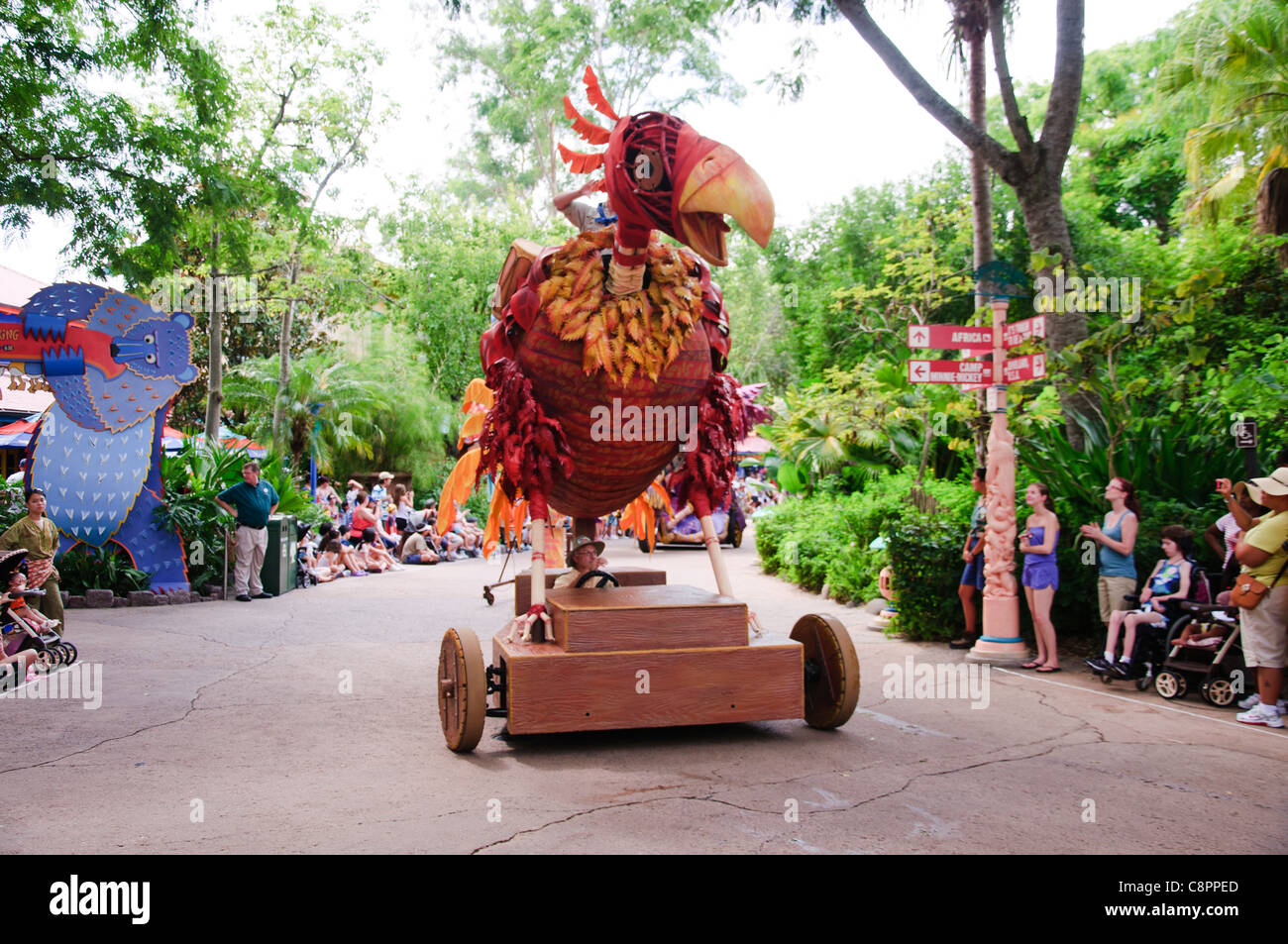 street entertainers and floats in mickeys jammin jungle parade in the ...