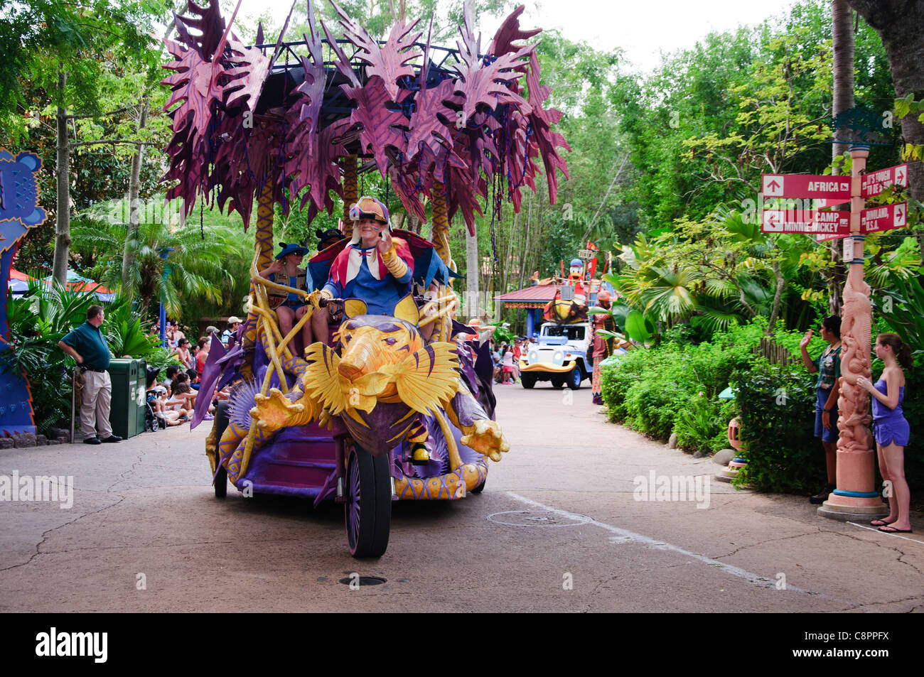 street entertainers and floats in mickeys jammin jungle parade in the ...
