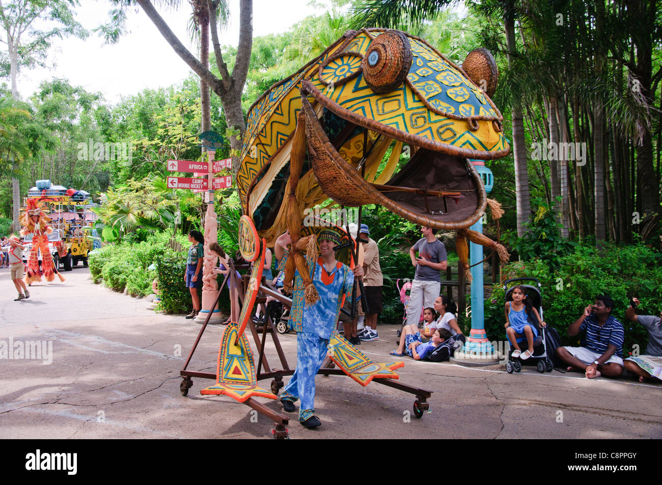 street entertainers and floats in mickeys jammin jungle parade in the ...