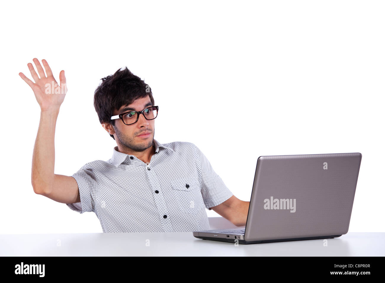 Young man looking to something terrible at his laptop Stock Photo - Alamy