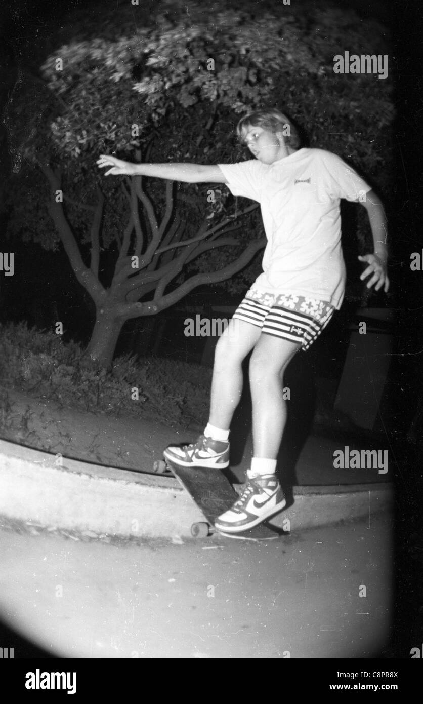 Brian Hulse rail slides during a late night skateboarding session at ...