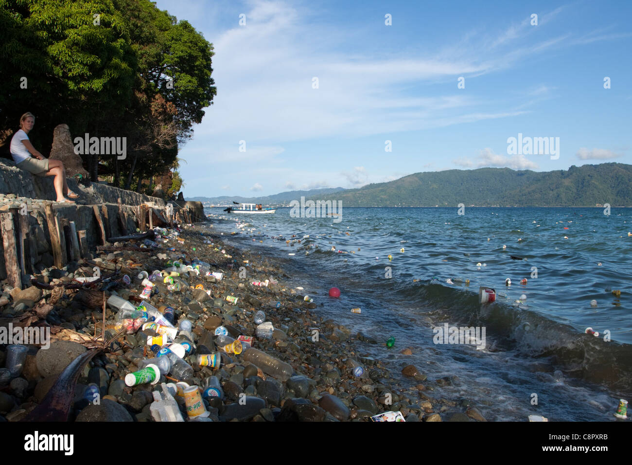 Plastic bottles and litter floating in the sea. Ambon, Indonesia Stock ...