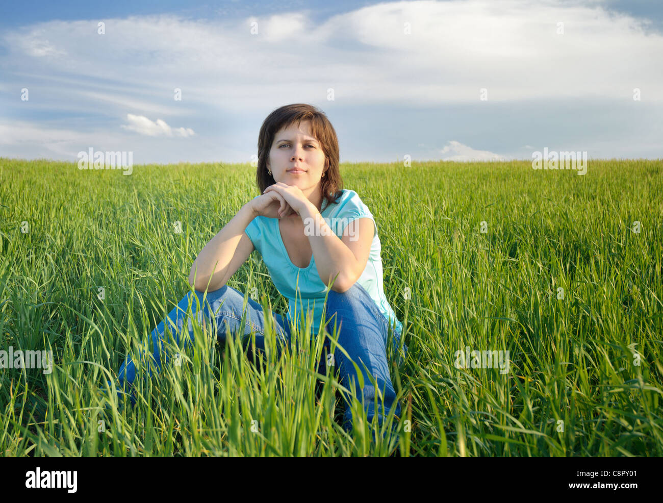 Young girl in a field Stock Photo - Alamy