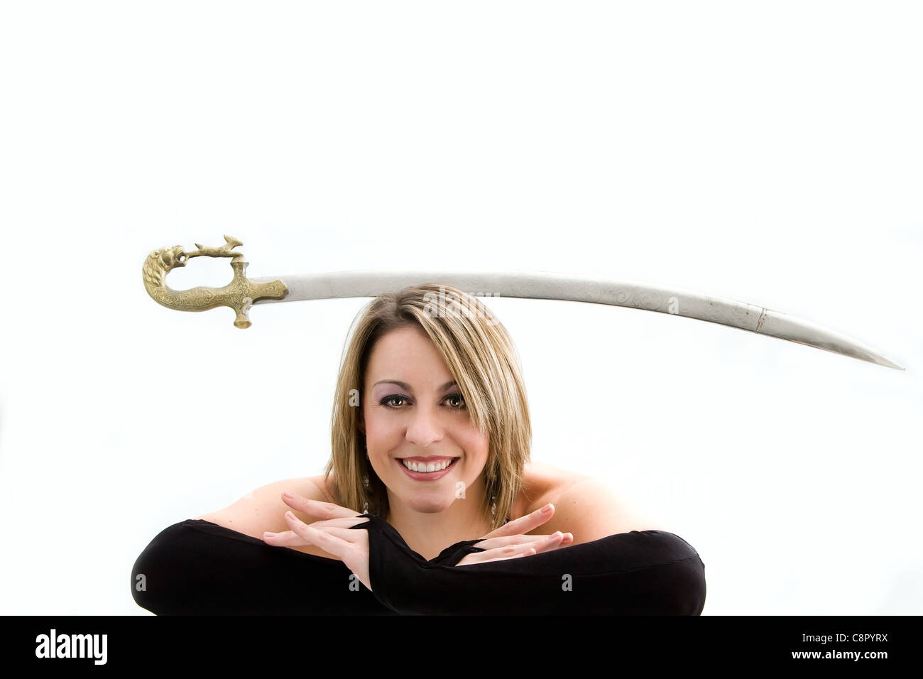 Blond balancing sword Stock Photo - Alamy