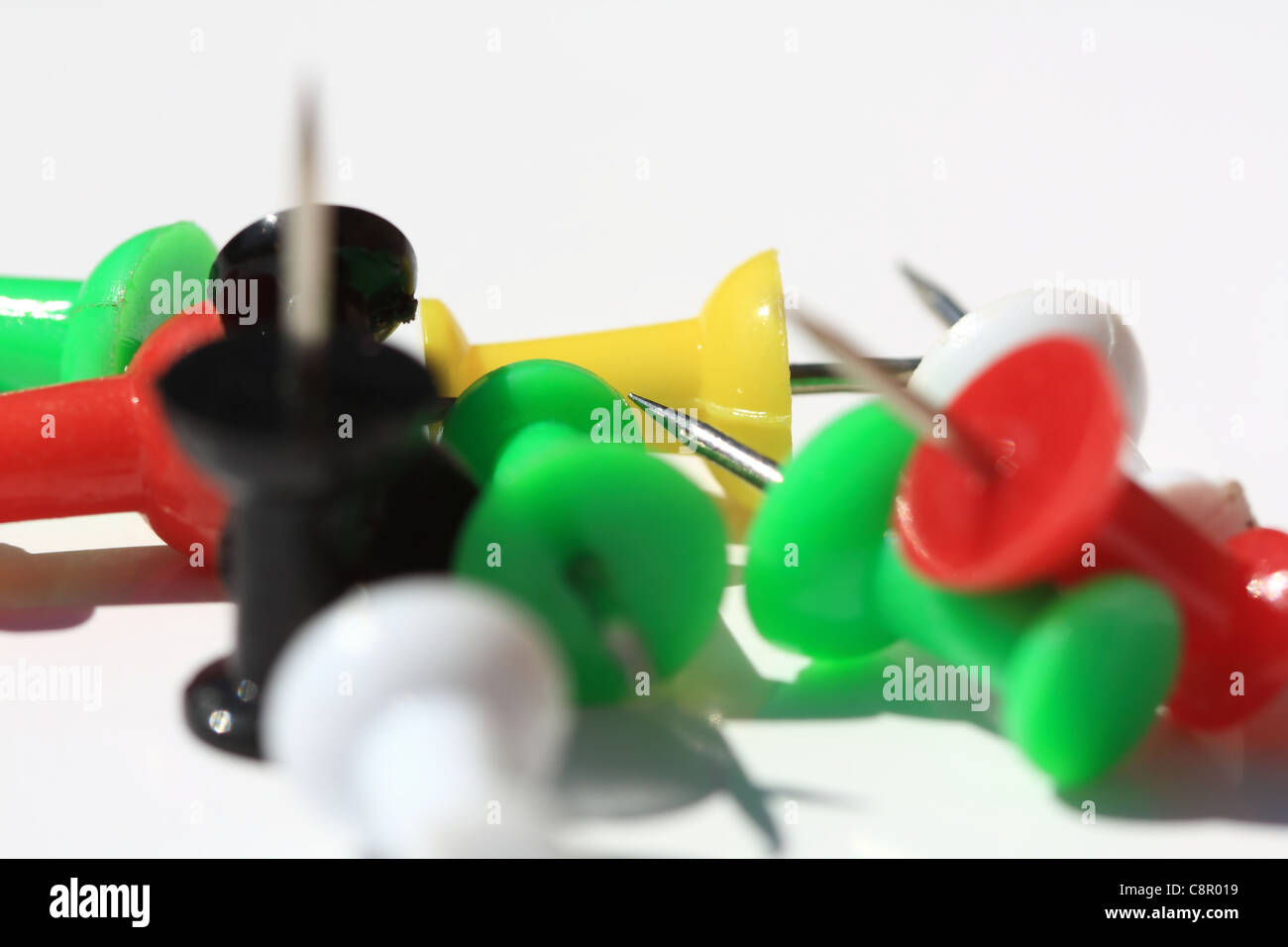 Notes colored pins on a white background Stock Photo - Alamy