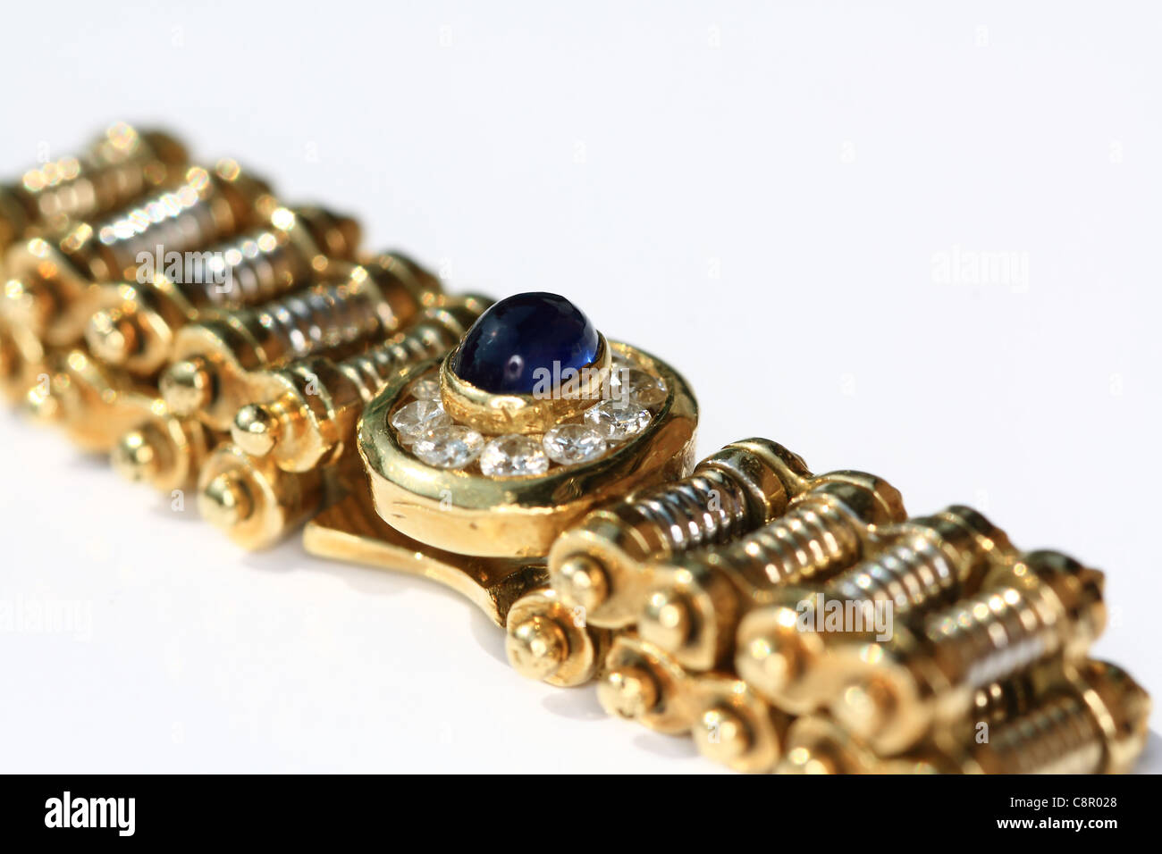 Chains ring with sapphire isolated Stock Photo - Alamy