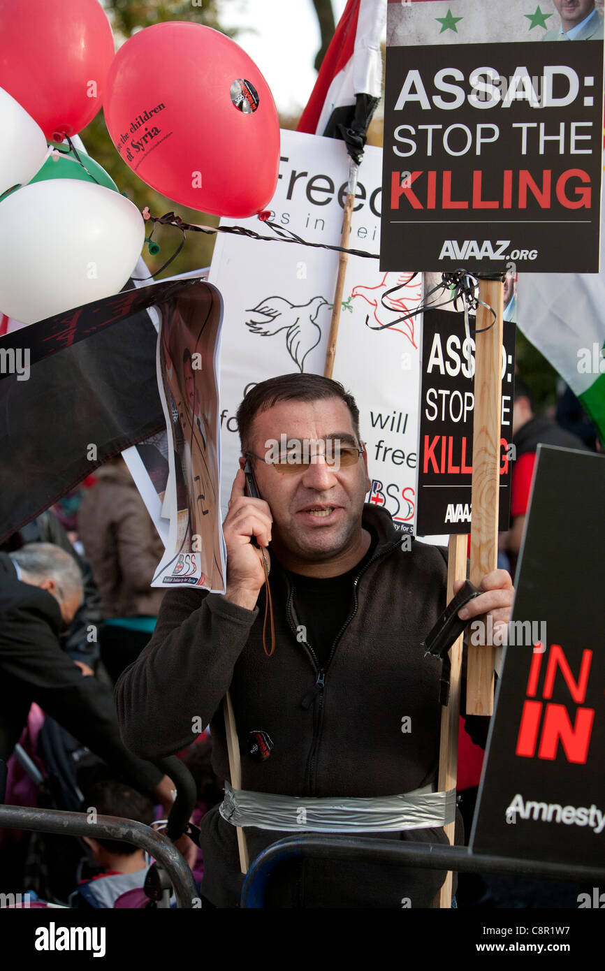 Protesters protest outside the Syrian Embassy in London Stock Photo - Alamy