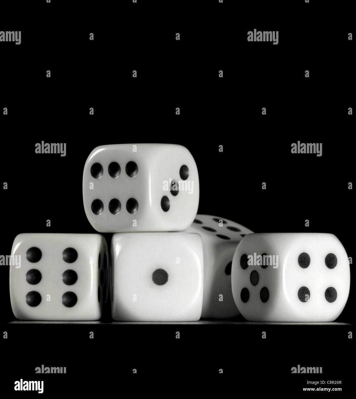 surface angle closeup studio photography of some dice in dark back ...