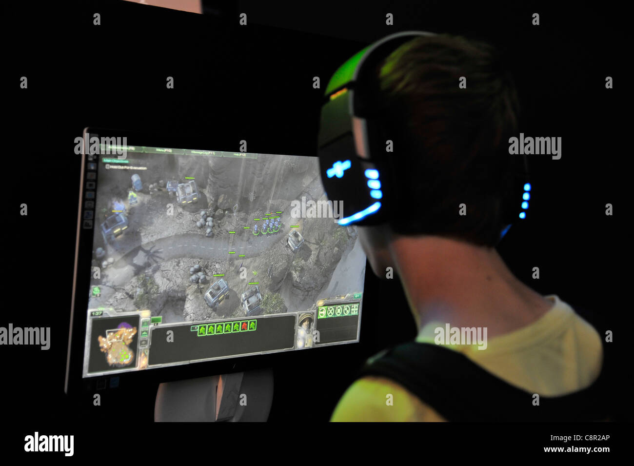 male teenager plays Computer role-playing game at the gamescom ...