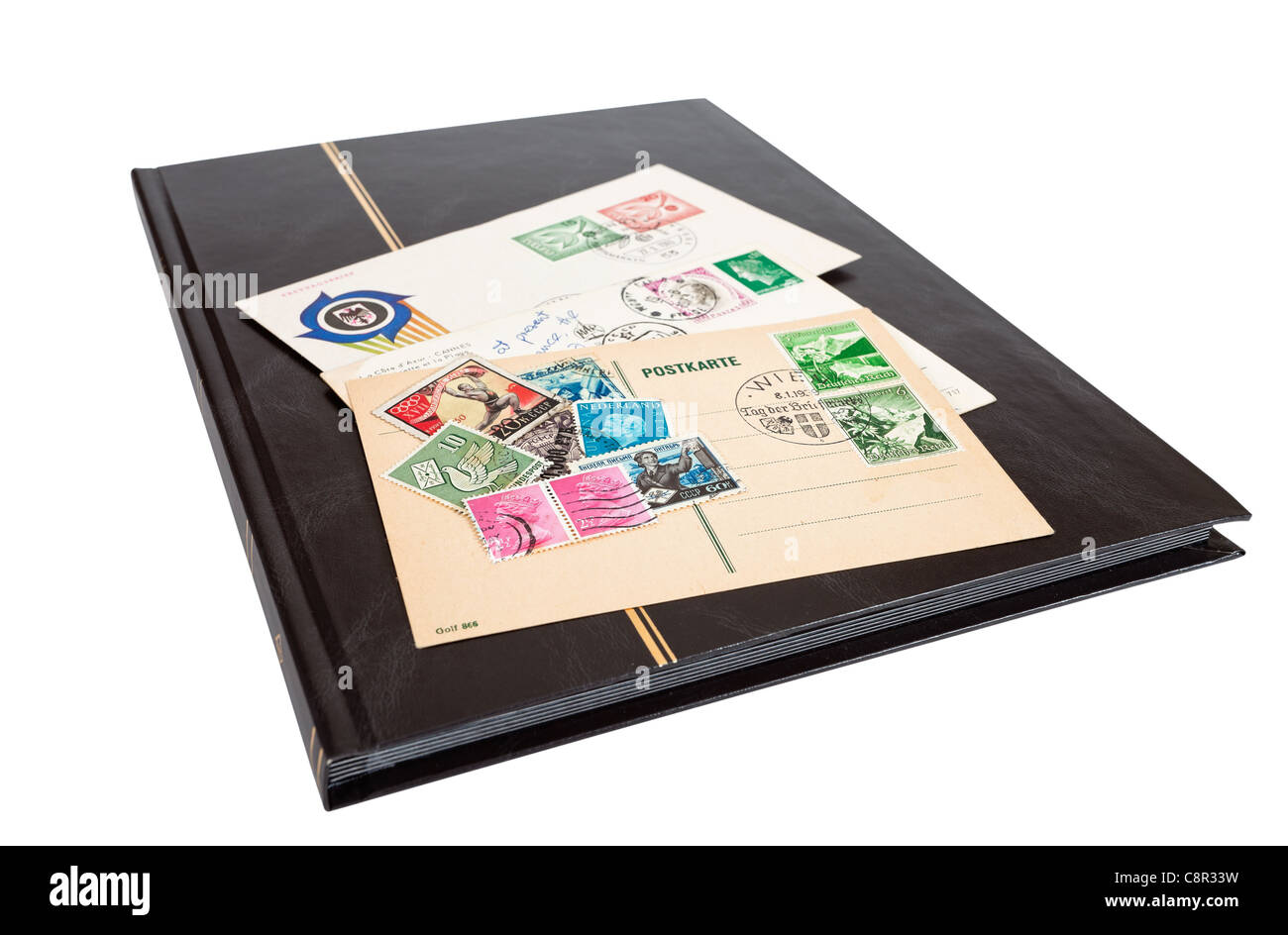 Album of postage stamps isolated on white background Stock Photo - Alamy