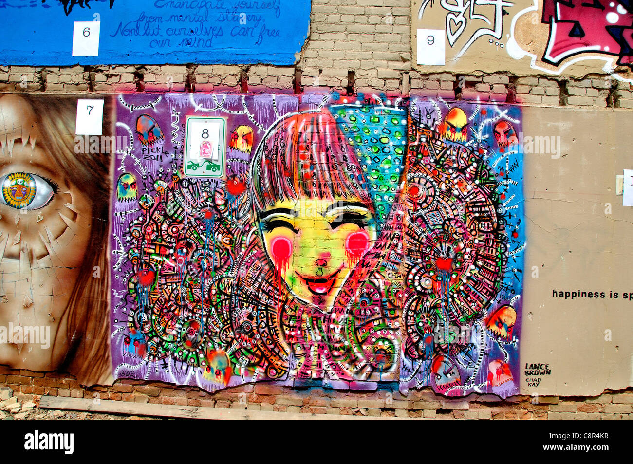 Art on brick wall of building in "Freak Alley Stock Photo - Alamy