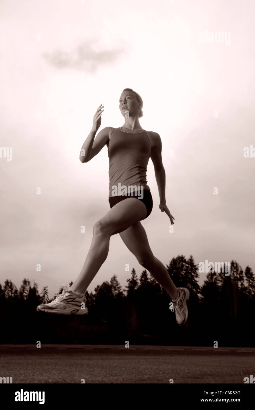 Serious Caucasian woman running Stock Photo - Alamy