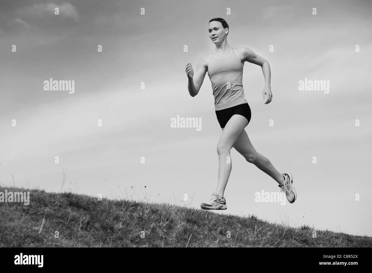 Serious Caucasian woman running Stock Photo - Alamy