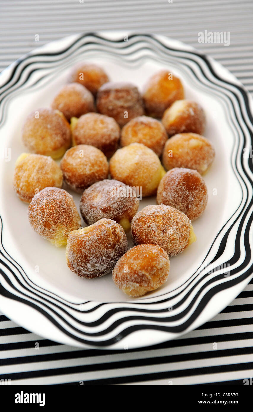 Fried dough balls coated in sugar on a Missoni designed plate and ...