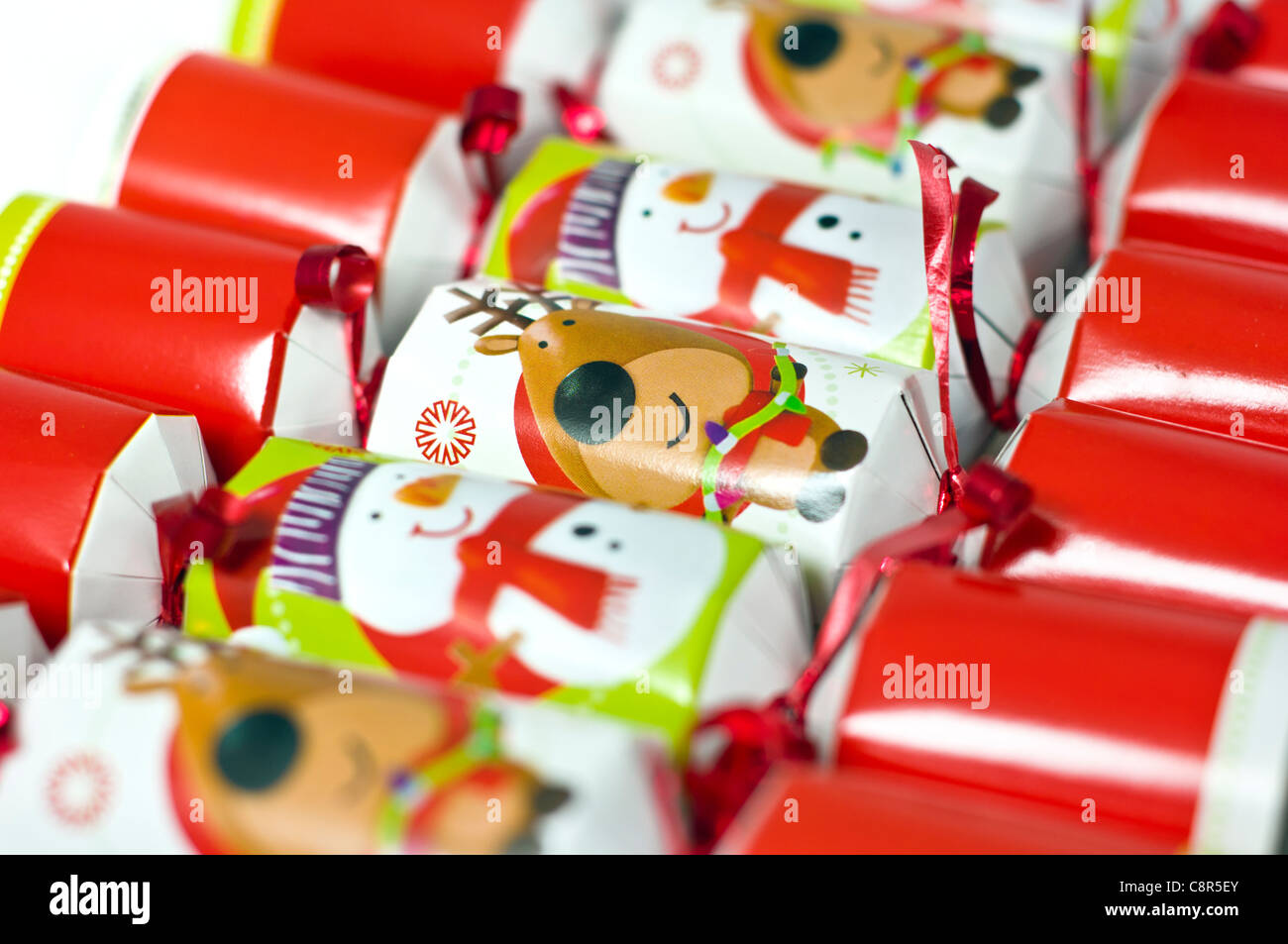 Five mini Christmas crackers. Shallow depth of field concentrated on ...