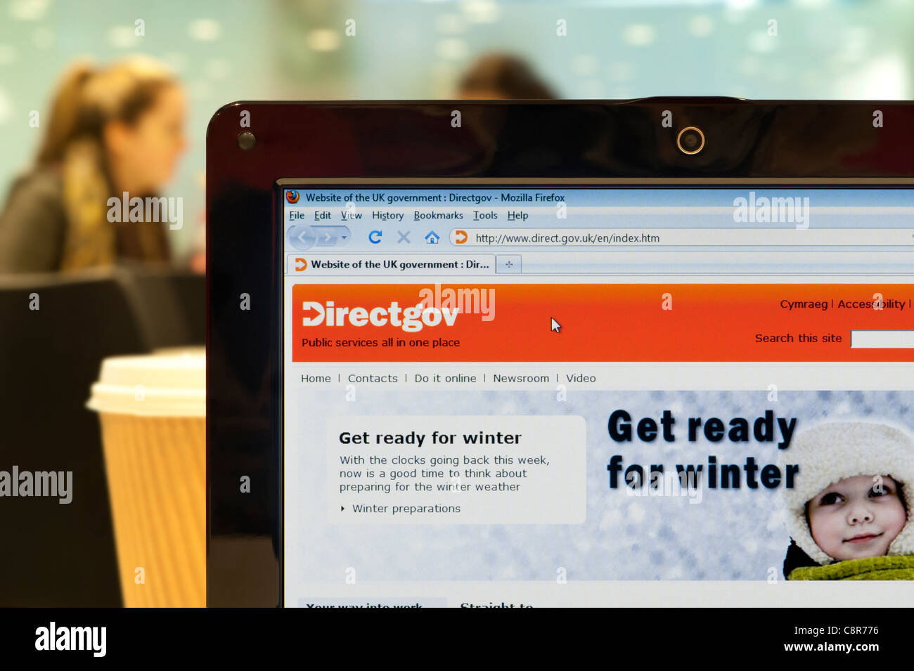 The Directgov website shot in a coffee shop environment (Editorial use ...