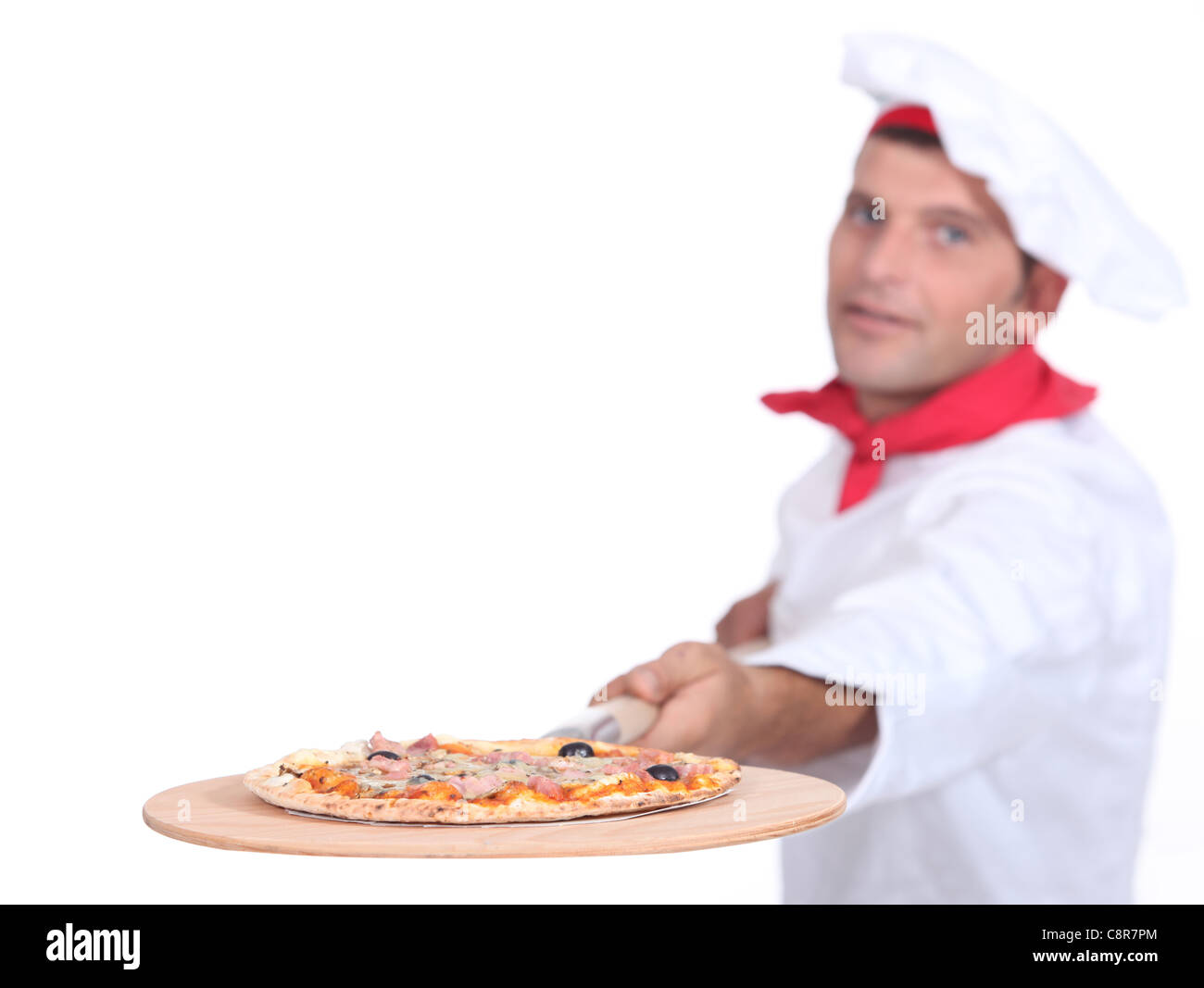 Cook serving pizza Stock Photo - Alamy