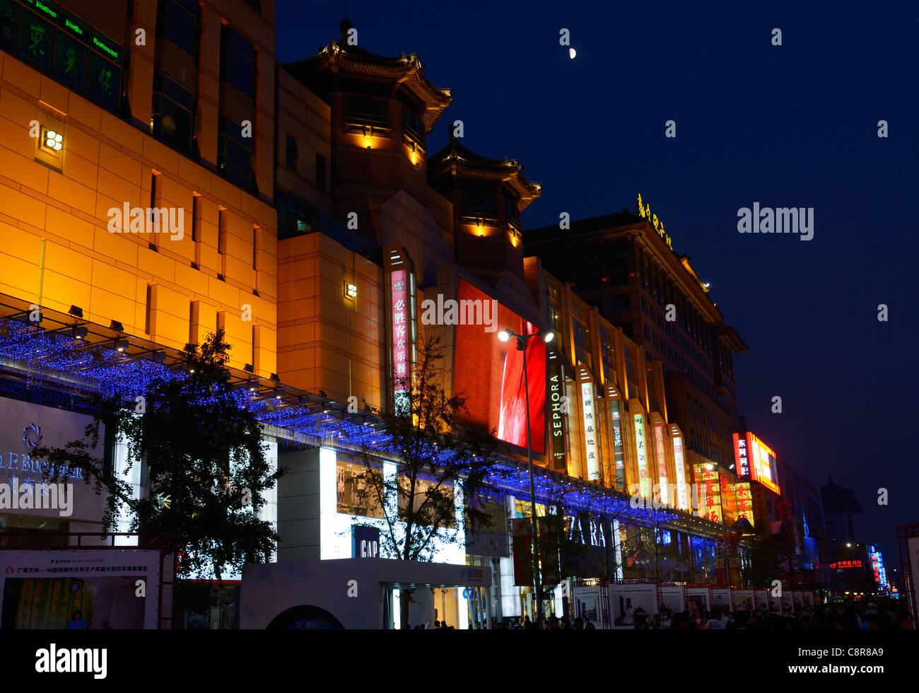 Night lights on Wangfujing street Beijing at twilight with half moon ...