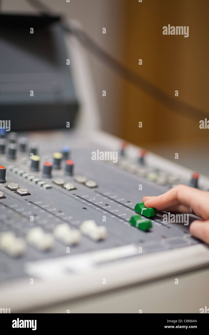Portrait of a hand setting the sound Stock Photo - Alamy