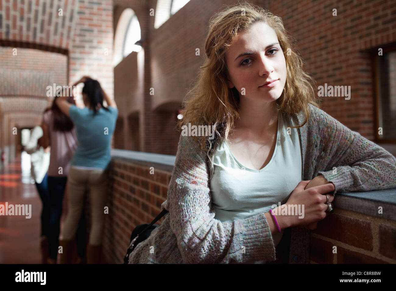 Lonely student standing up Stock Photo - Alamy