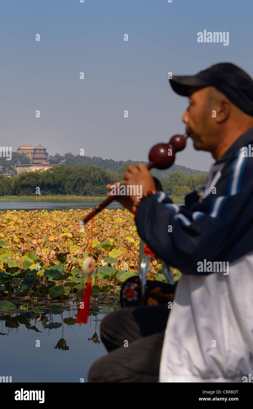 Man playing a Hulusi or Curcubit flute at Hall of Recognition of Talent ...