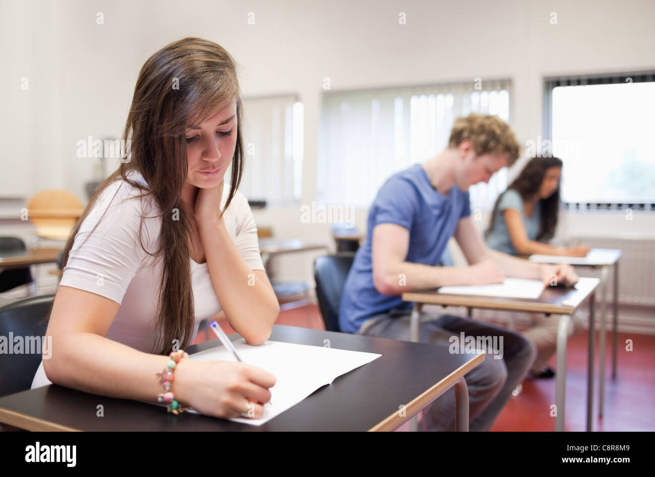 Serious young adults studying Stock Photo - Alamy