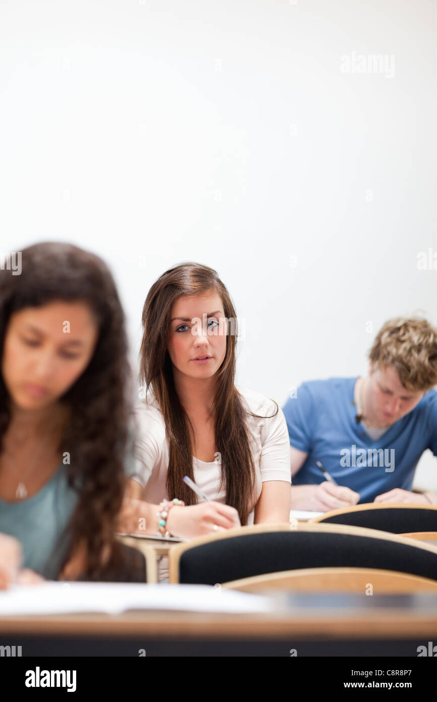 Young students sitting on a chair Stock Photo - Alamy