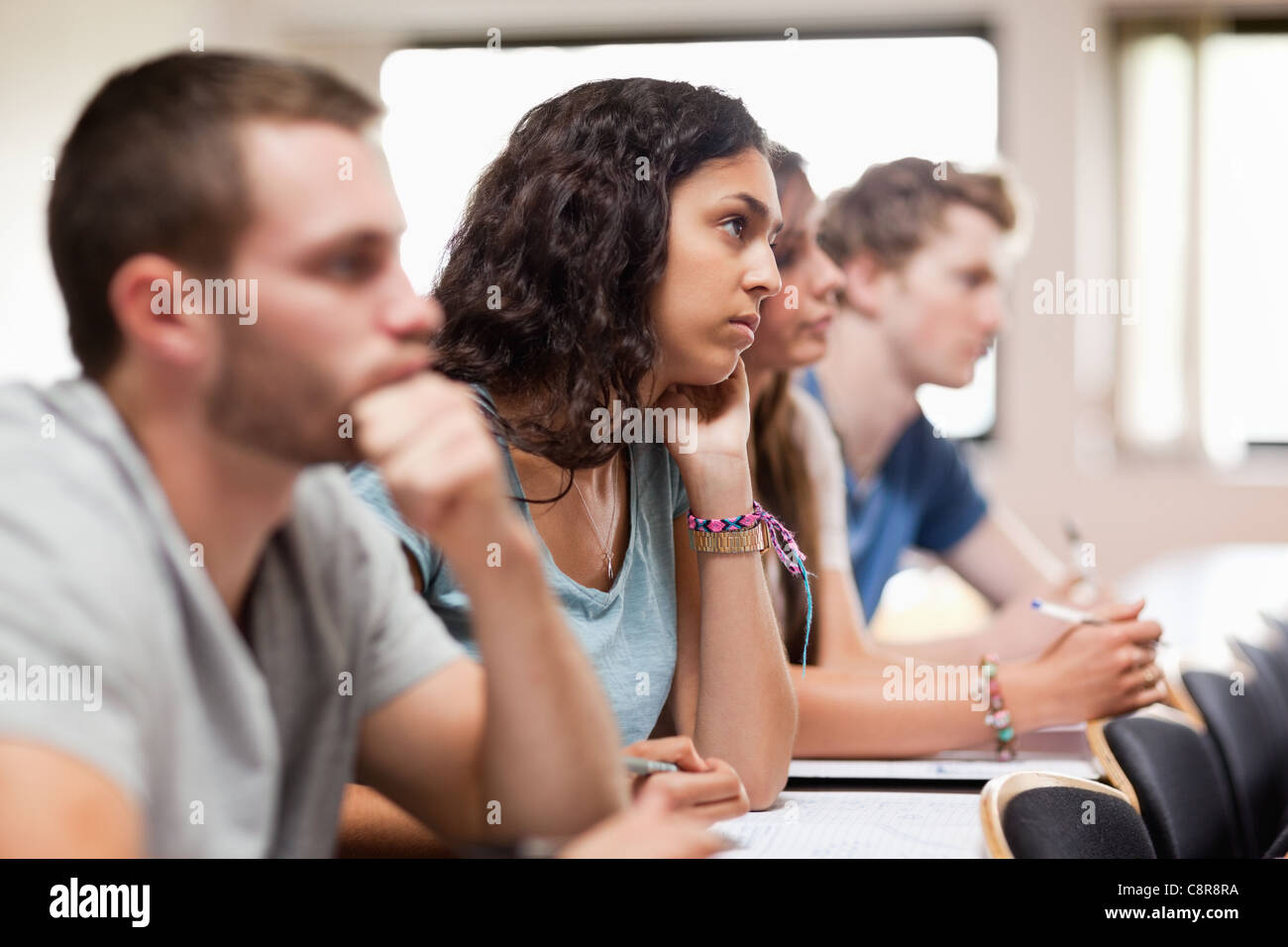 Students listening a lecturer Stock Photo - Alamy