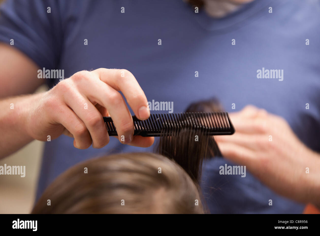 Hand combing hair Stock Photo - Alamy