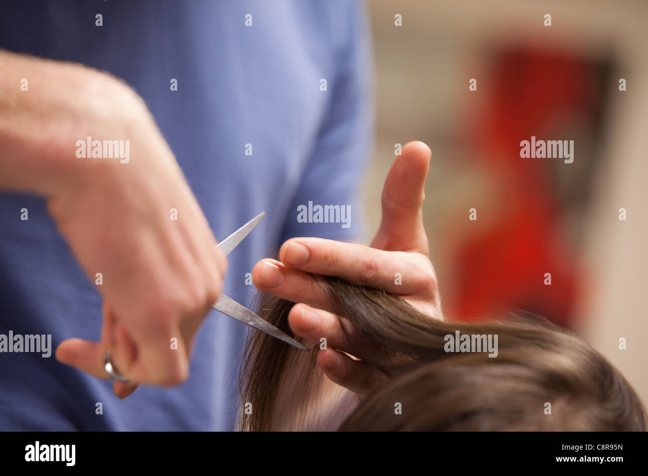 Close up of a masculine hand cutting hair Stock Photo - Alamy
