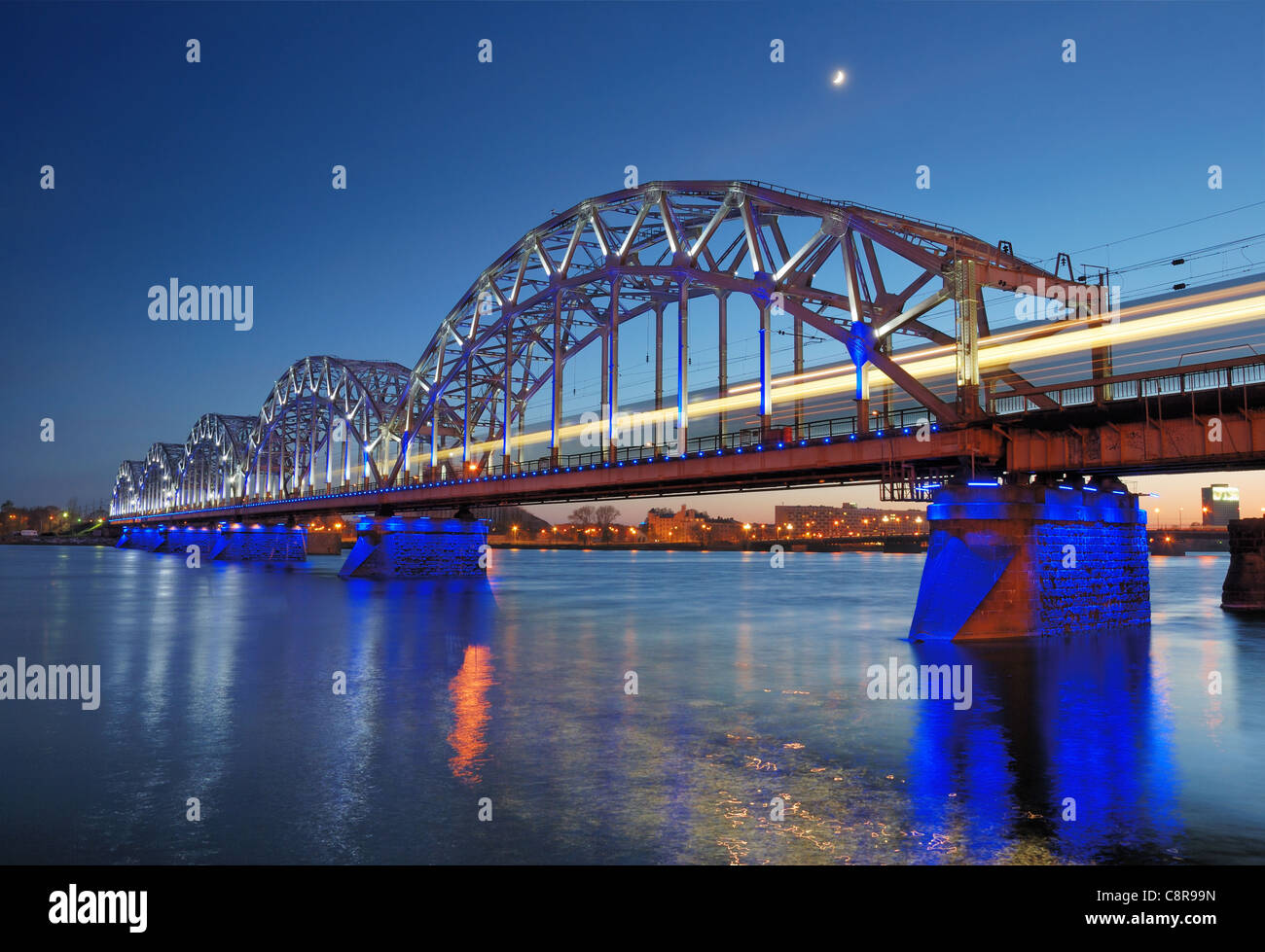 The railway riveted bridge across Daugava river in Riga, Latvia Stock ...