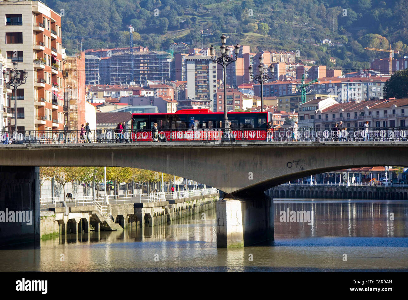 Red bus Bilbobus on Ponte del Arenal in Bilbao, Basque Country, Spain ...