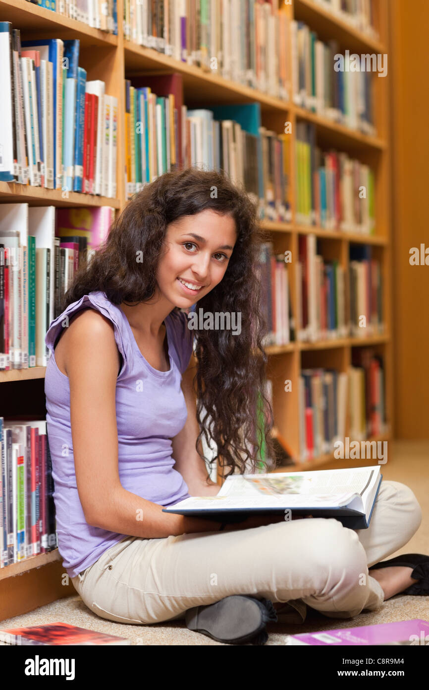 Portrait of a female student with a book Stock Photo - Alamy