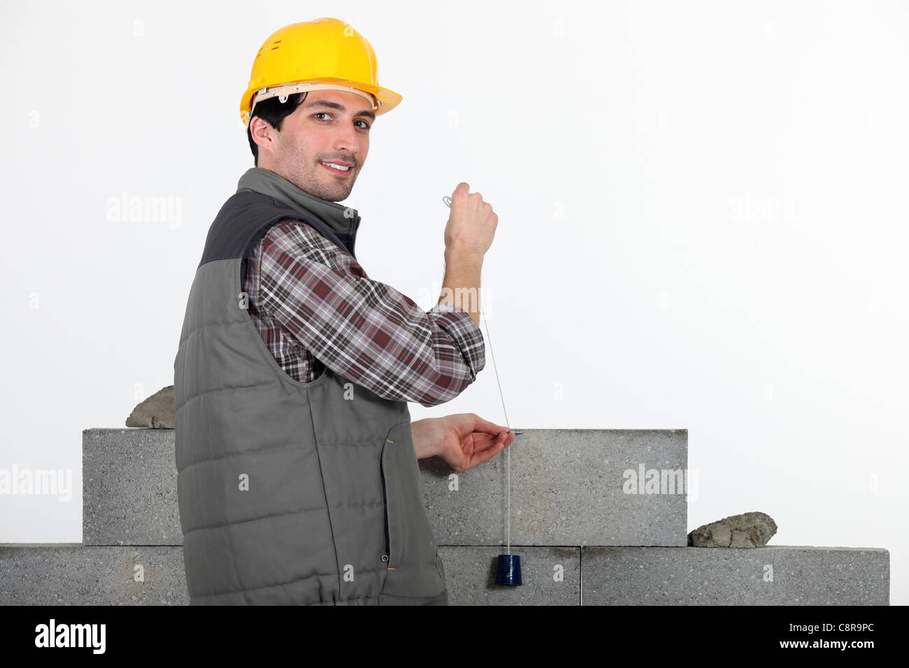 mason building a wall Stock Photo - Alamy