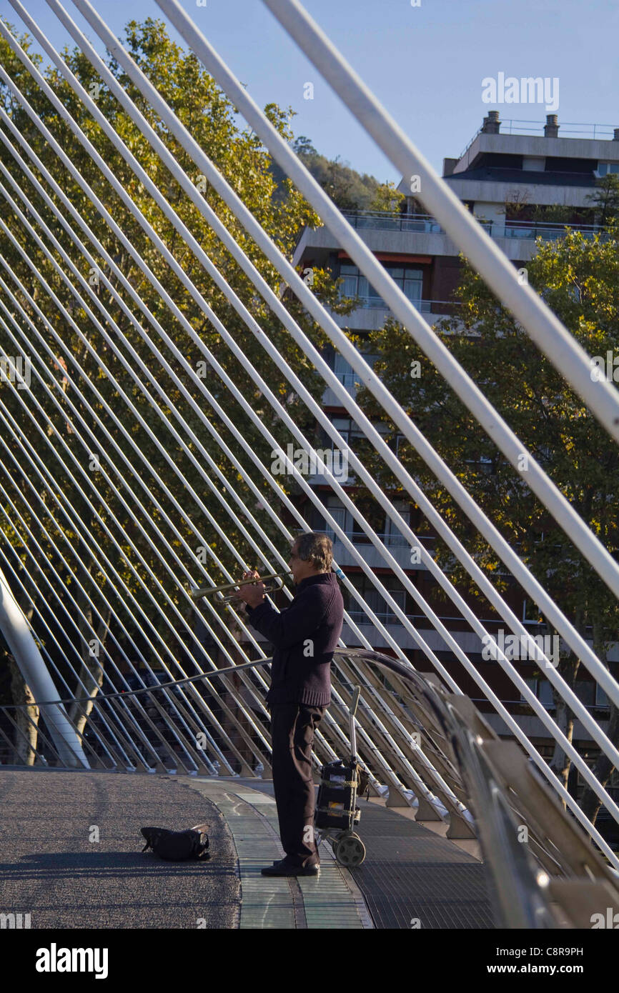 Busker on zubizuri footbridge bilbao hi-res stock photography and ...