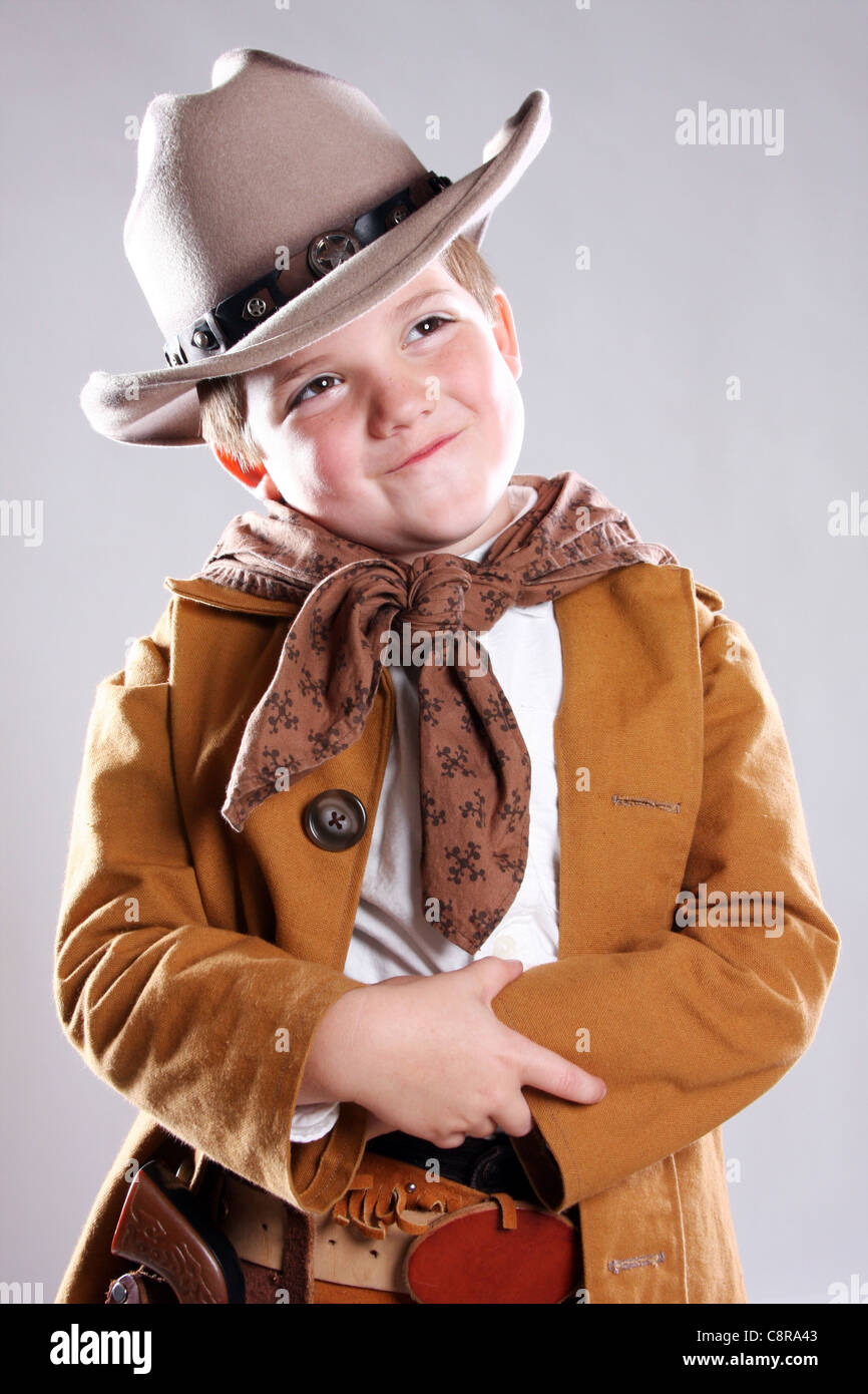 A cute smiling young cowboy Stock Photo - Alamy