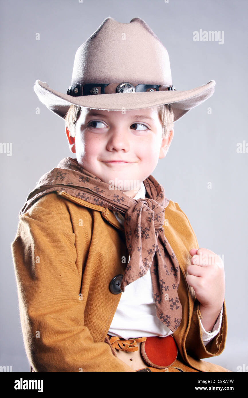A young cowboy child with fist ready to fight looking to right Stock ...