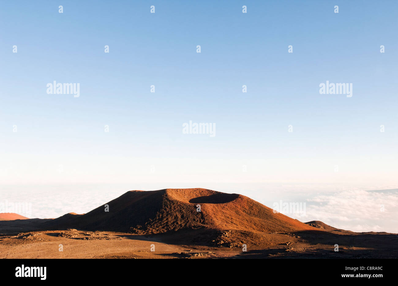Volcano against blue sky Stock Photo - Alamy
