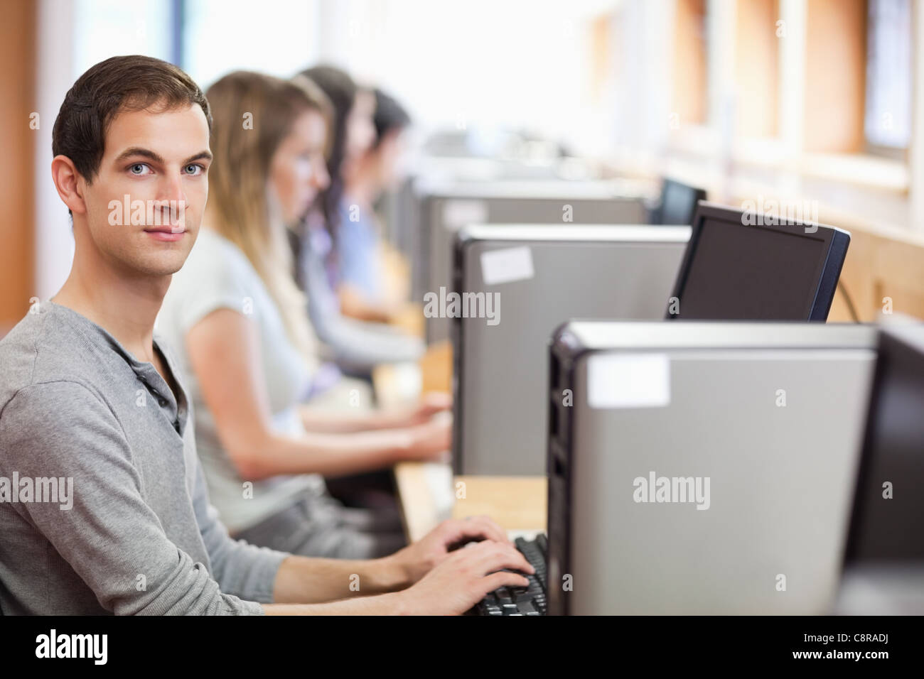 Male student posing with a computer Stock Photo - Alamy