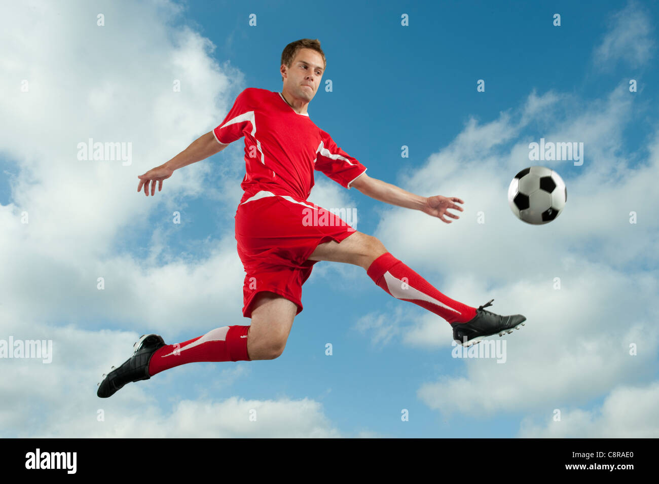 Someone Kicking A Soccer Ball In The Air