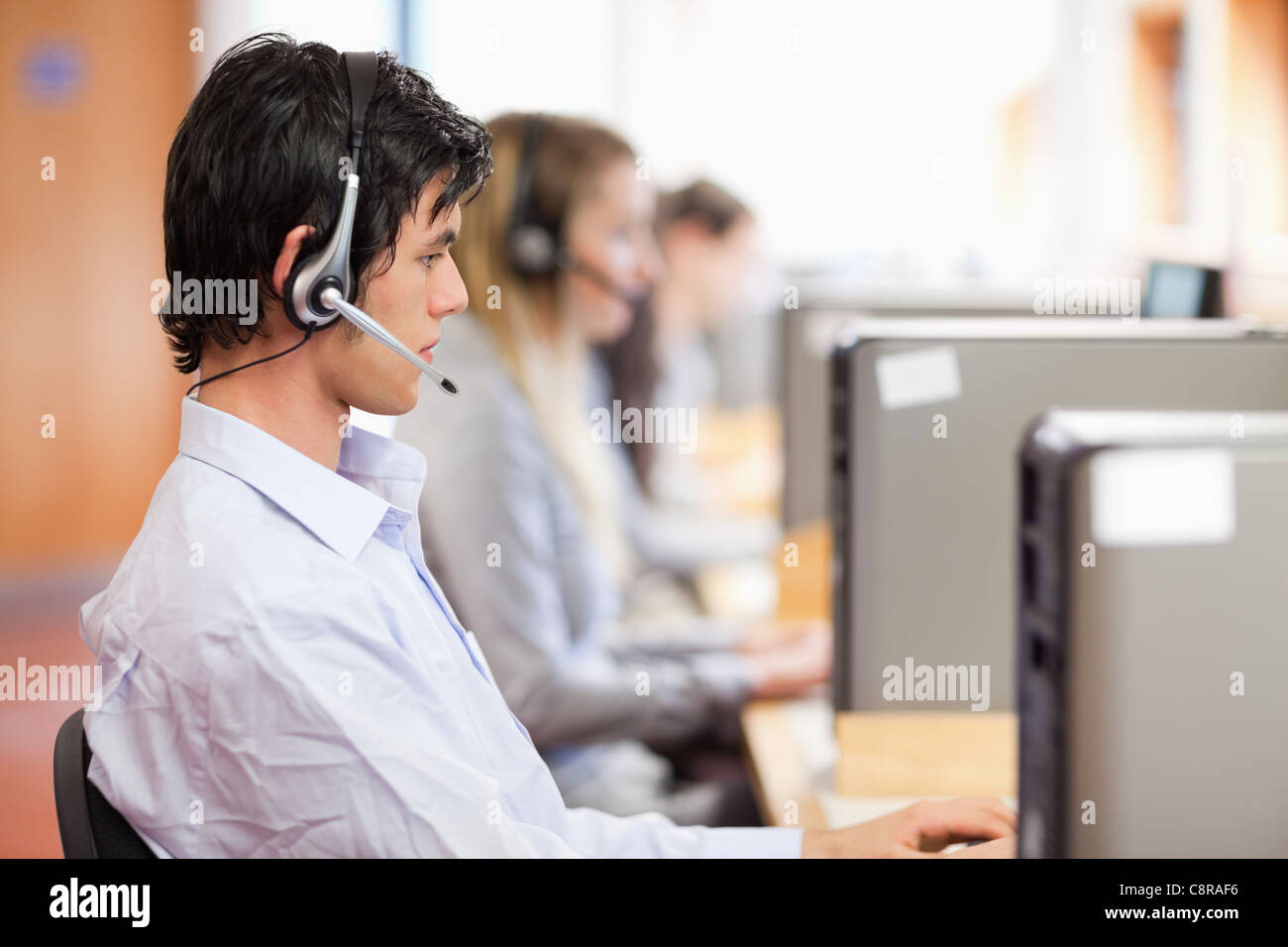 Young operators using a computer Stock Photo - Alamy