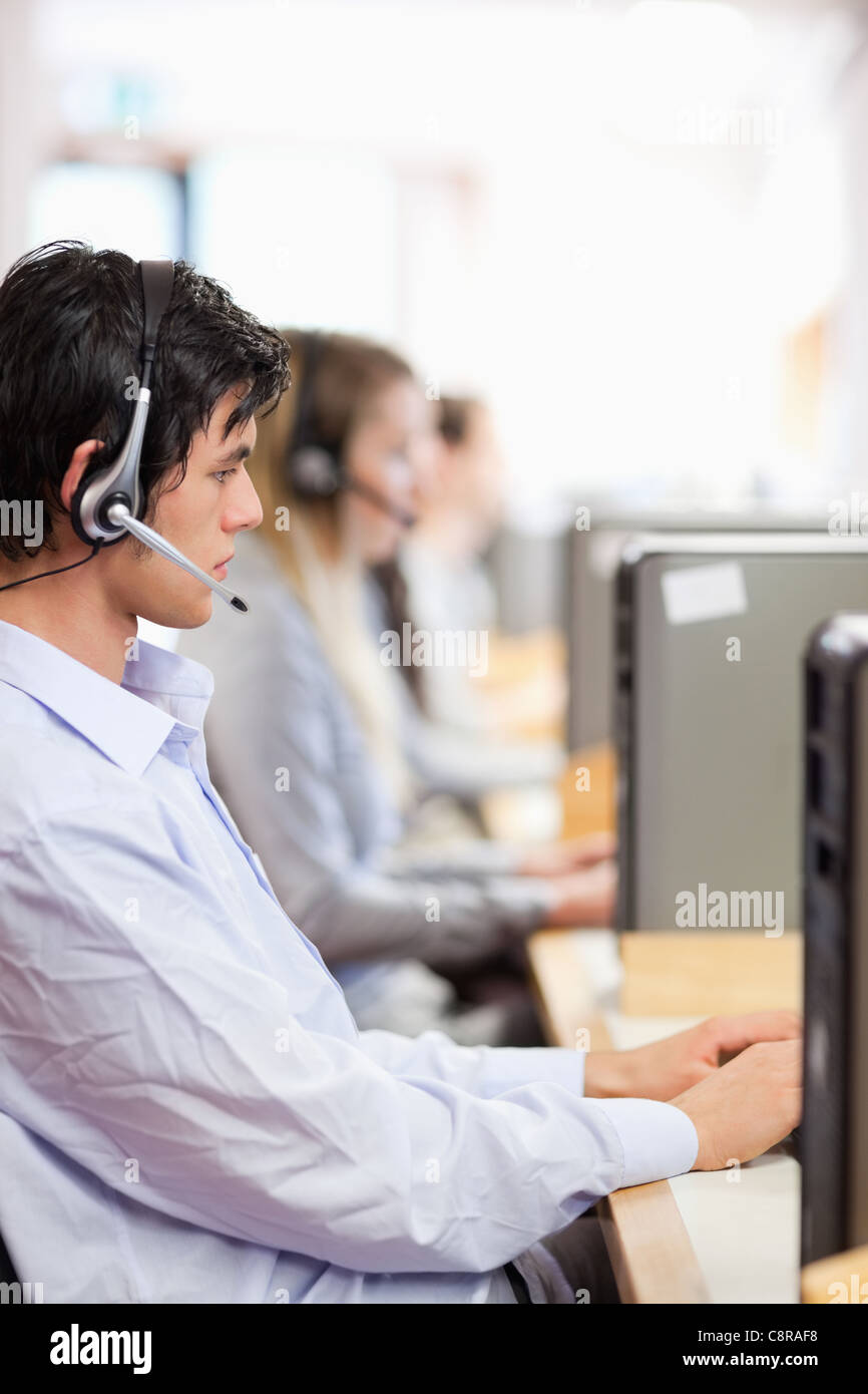 Portrait of young operators using a computer Stock Photo - Alamy