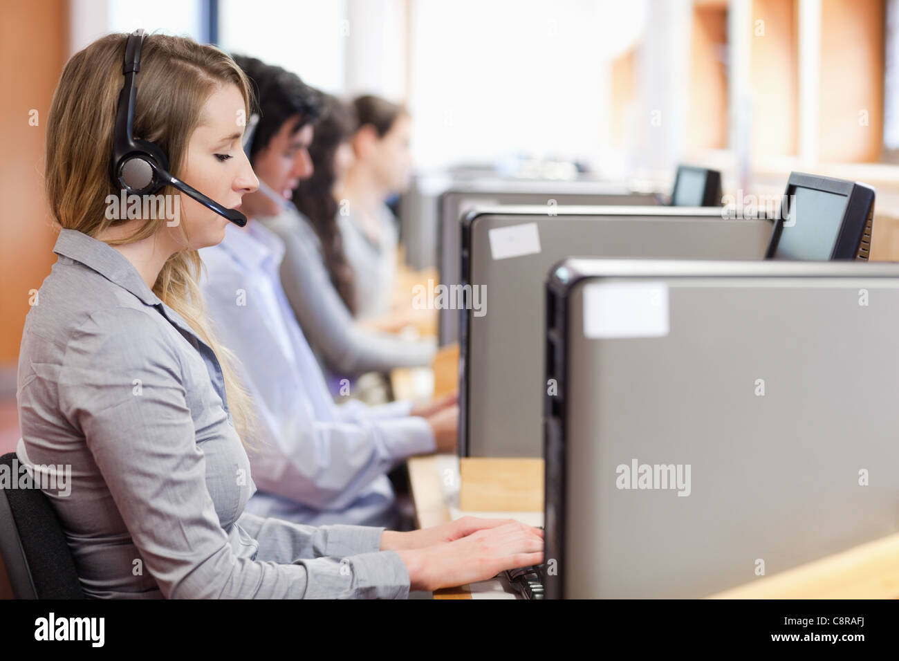 Operators using a computer in call center Stock Photo - Alamy