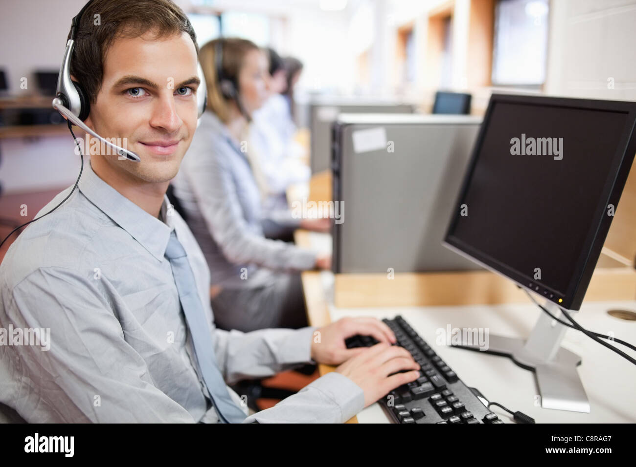 Assistant using a computer Stock Photo - Alamy