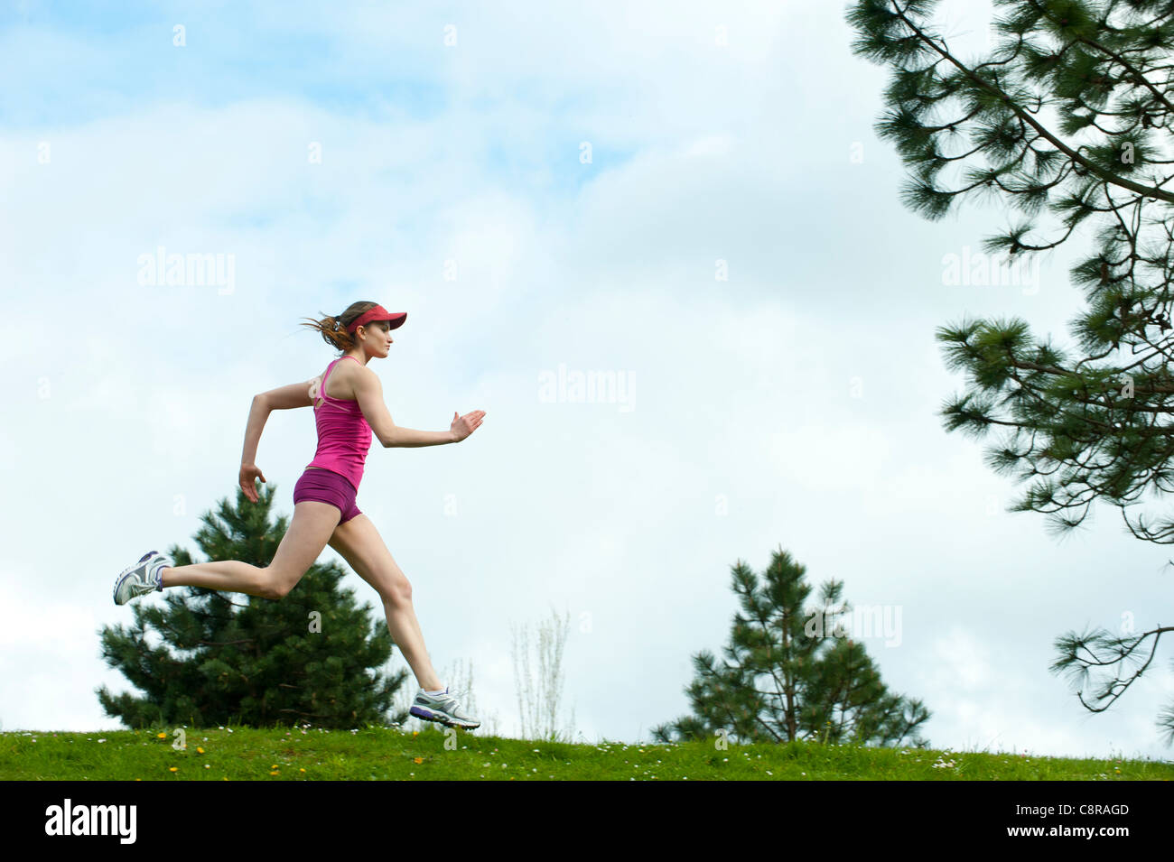 Mixed race woman running outdoors Stock Photo - Alamy