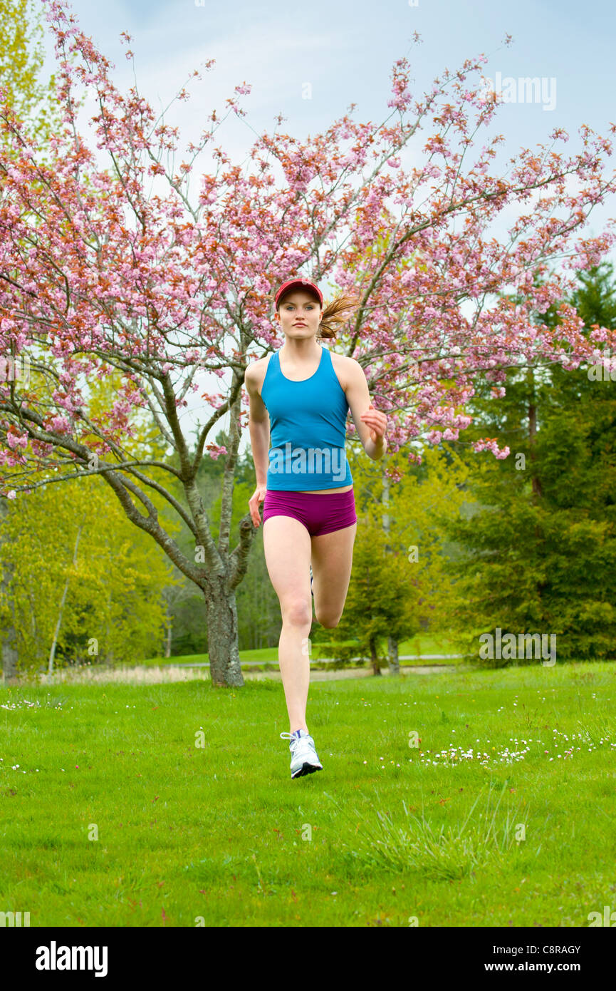 Mixed race woman running outdoors Stock Photo - Alamy