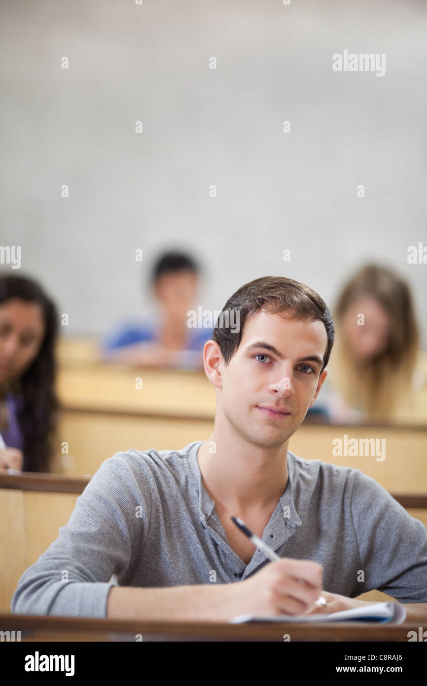 Portrait of students taking notes in an amphitheater Stock Photo - Alamy