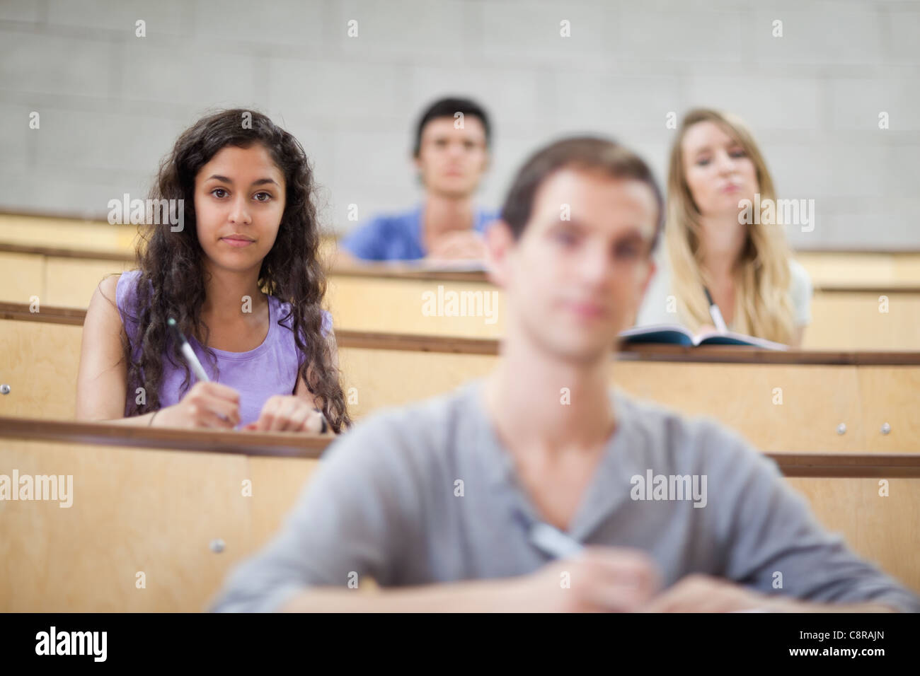 Focused students listening during a lecture Stock Photo - Alamy