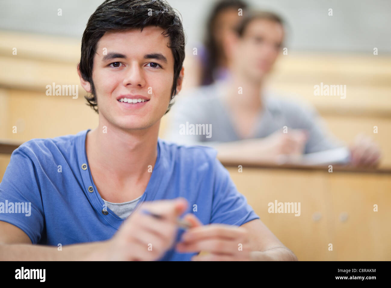 Student listening to a lecturer Stock Photo - Alamy